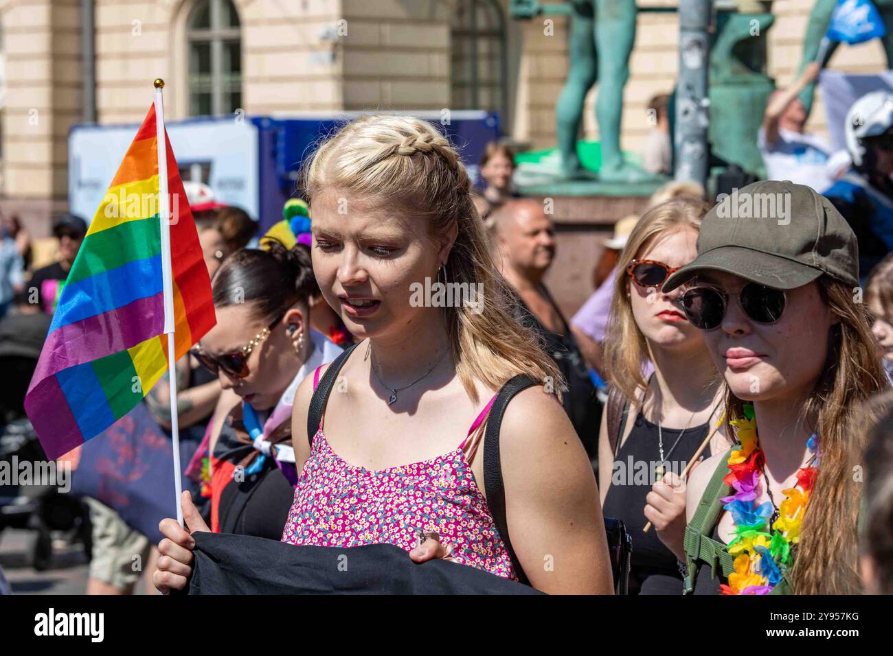 Young woman with a rainbow flag at Helsinki Pride 2024 Parade on ...