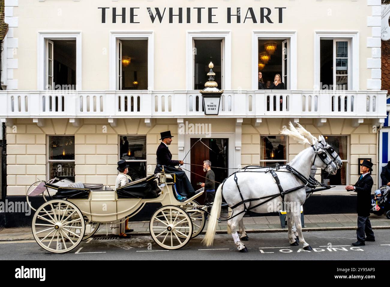 A Traditional Coach and Horses Parked In The High Street Advertises The ...