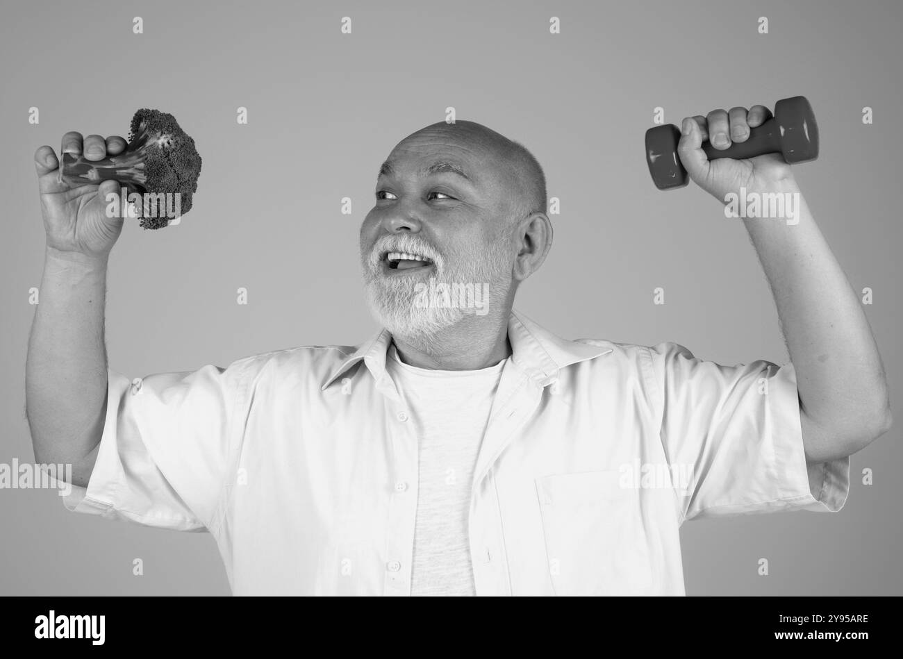 Healthy Senior. Healthy food. Power old mature man hold dumbbell and ...