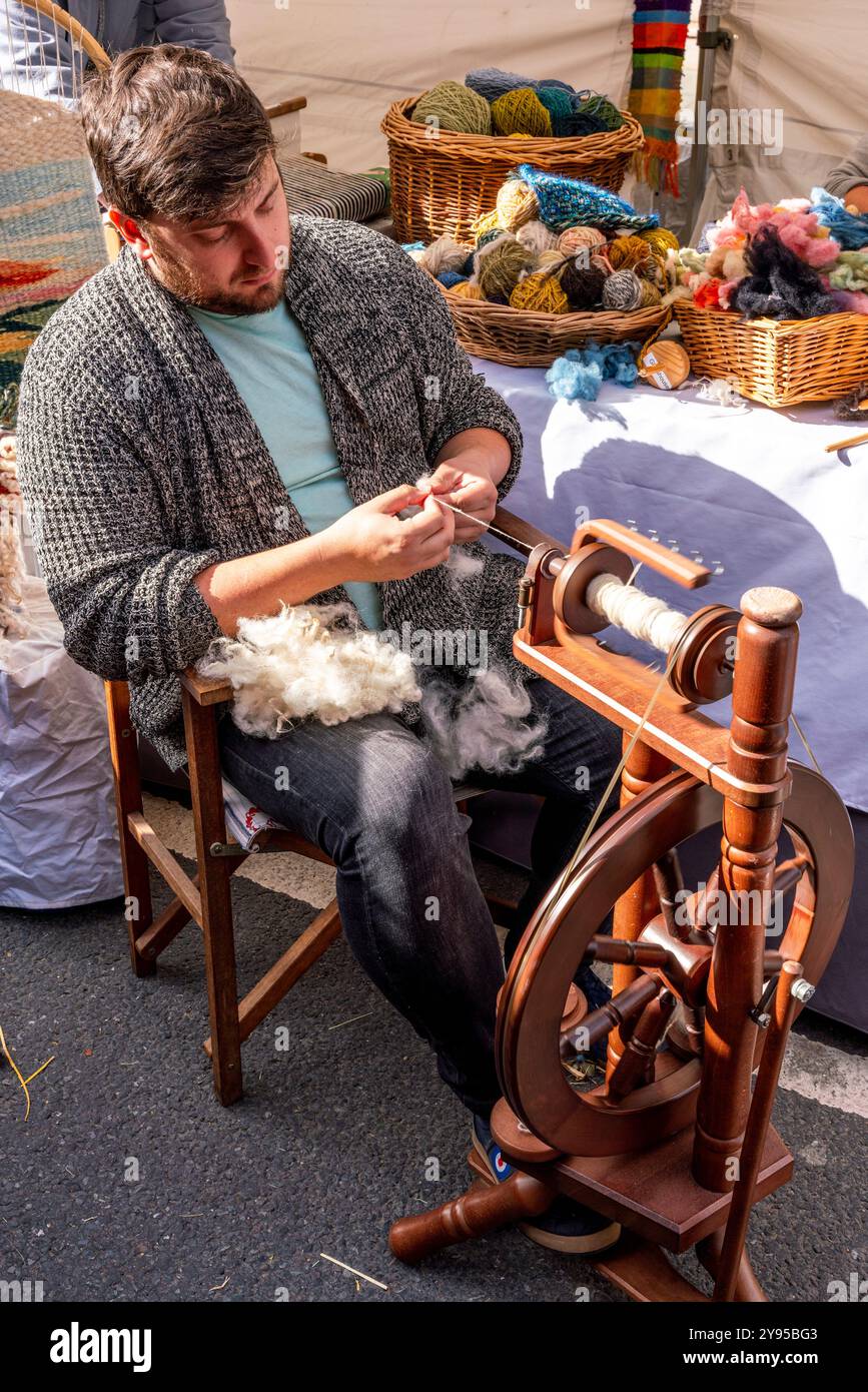 A Man Demonstrating Wool Spinning At The Annual Sheep Drive & Livery ...