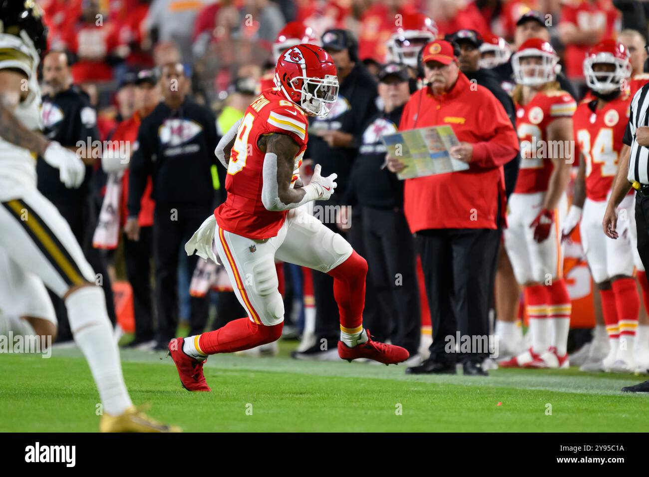 With Kansas City Chiefs head coach Andy Reid looking on at right ...