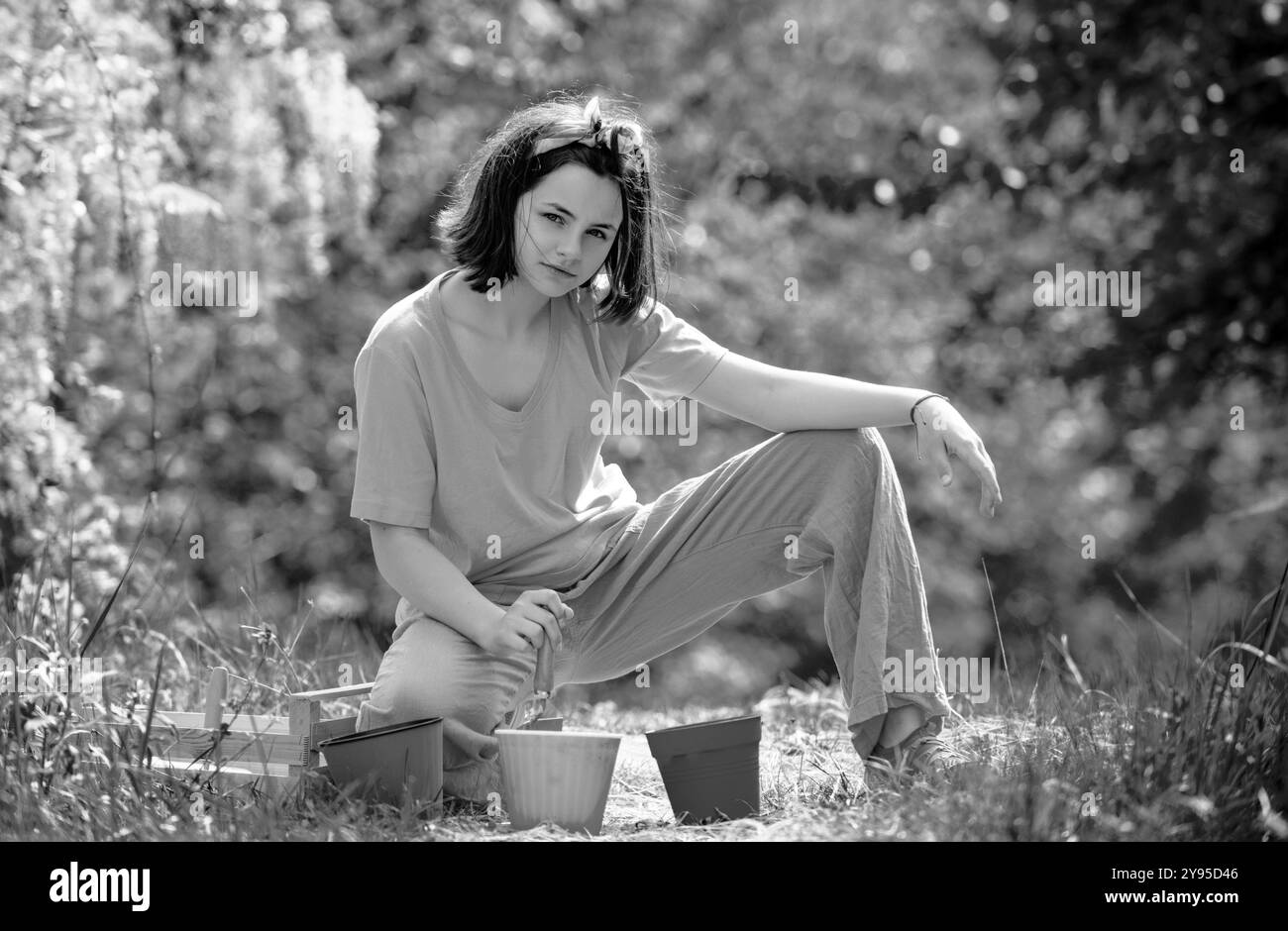 Little gardener gardening in the backyard garden. Young farmer. Become ...