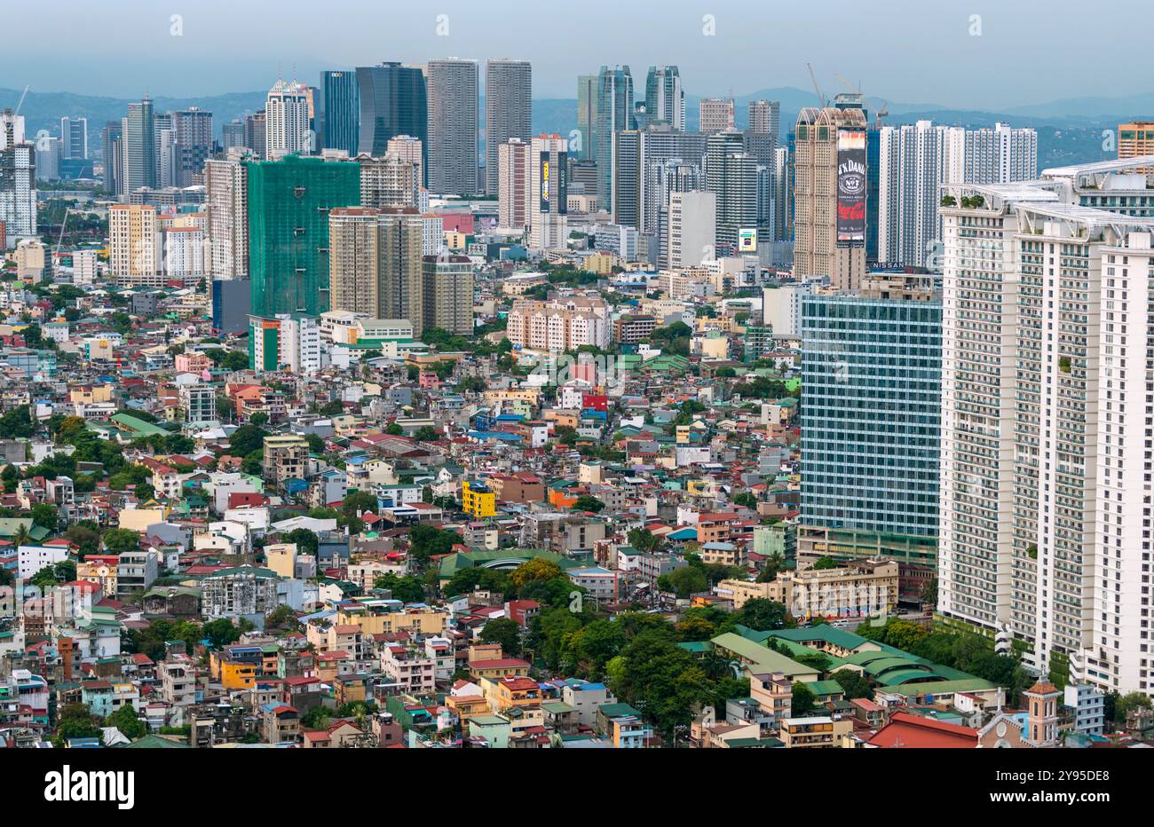 Manila,Luzon,The Philippines-May 19 2023: The setting sun casts warm ...