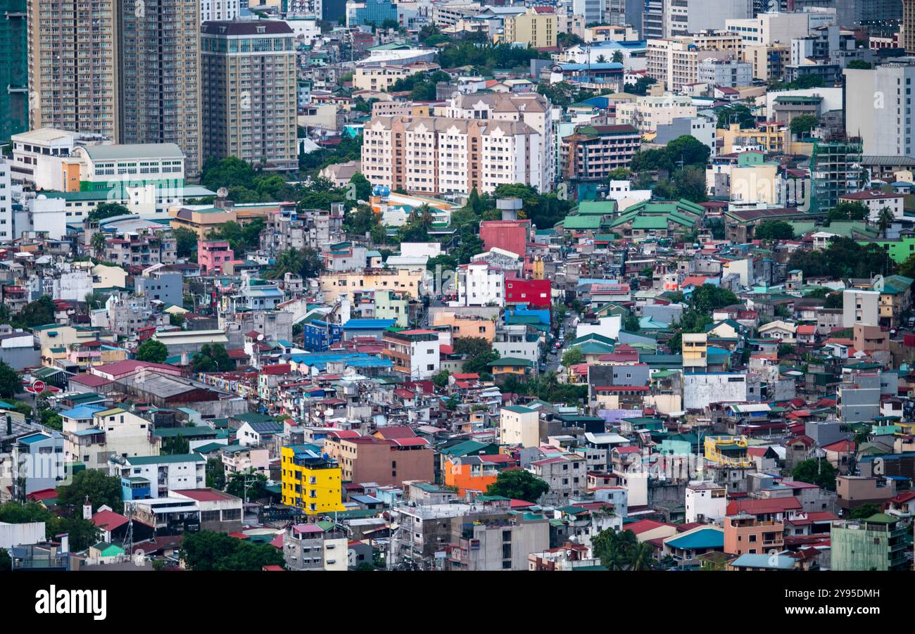 Manila,Luzon,The Philippines-May 19 2023: The setting sun casts warm ...