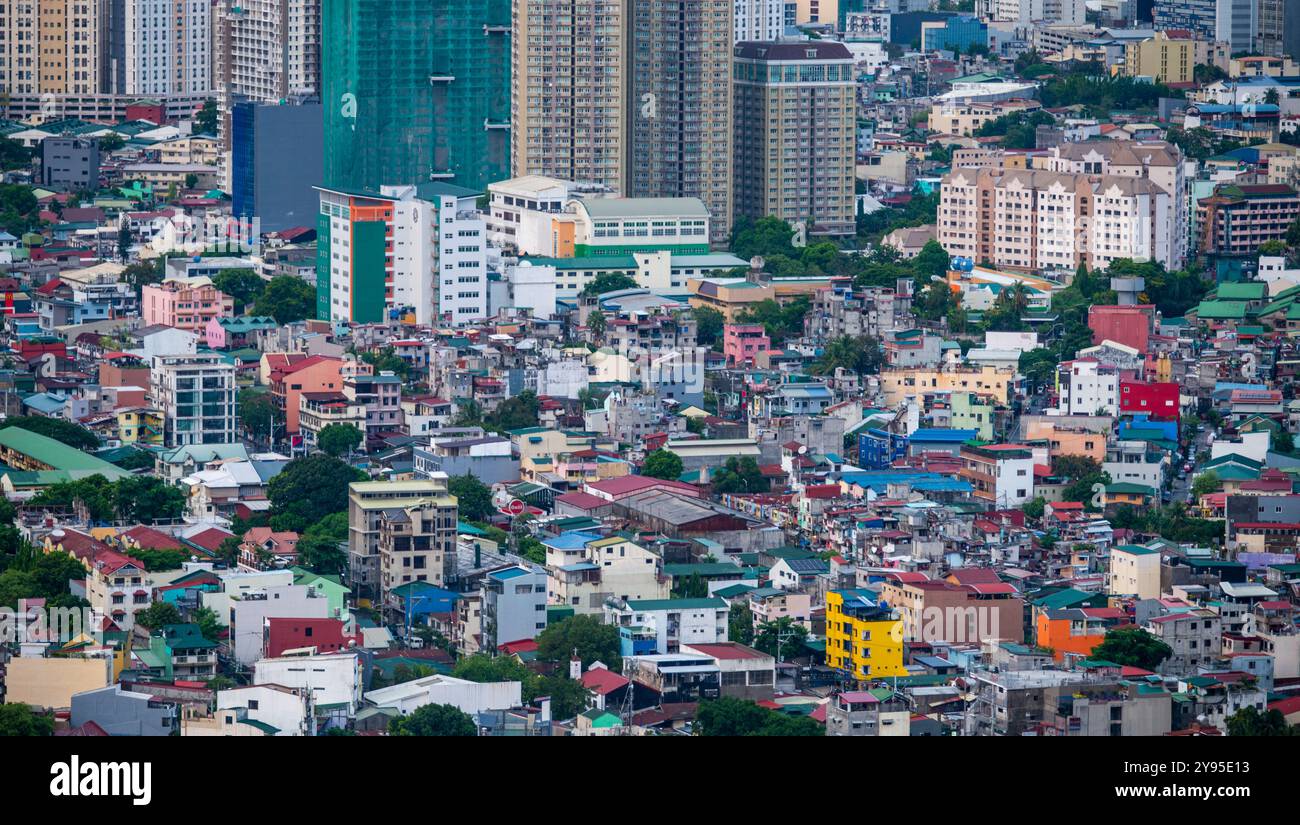 Manila,Luzon,The Philippines-May 19 2023: The setting sun casts warm ...