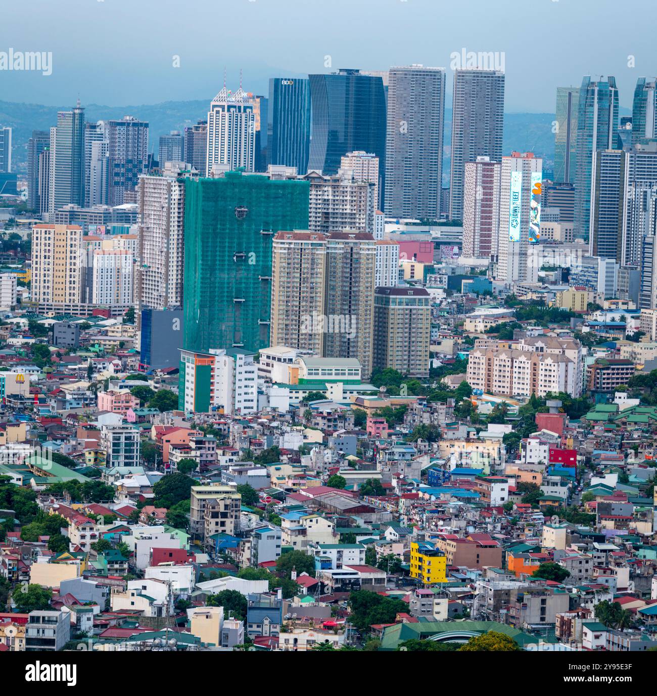 Manila,Luzon,The Philippines-May 19 2023: The setting sun casts warm ...