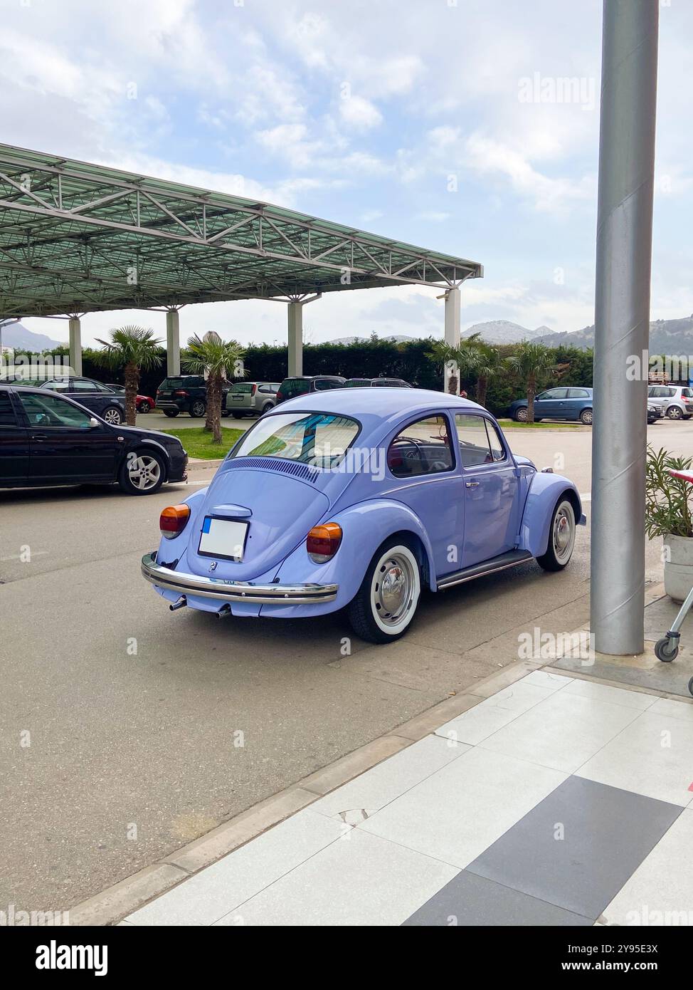 Vintage violet car on the street in summer. Old-fashioned nostalgia and ...