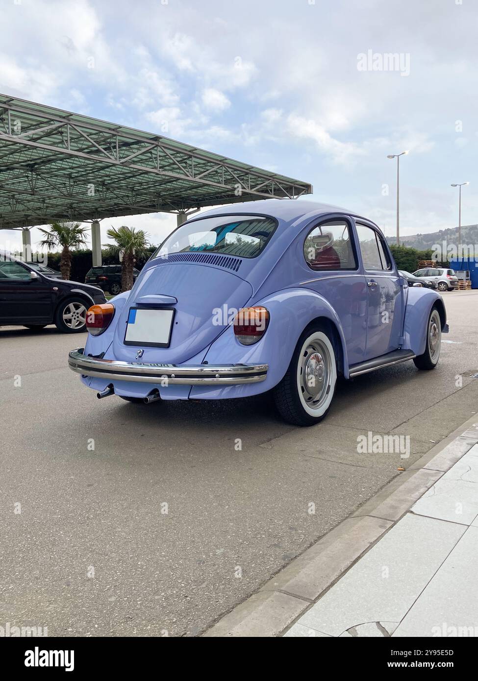 Vintage violet car on the street in summer. Old-fashioned nostalgia and ...