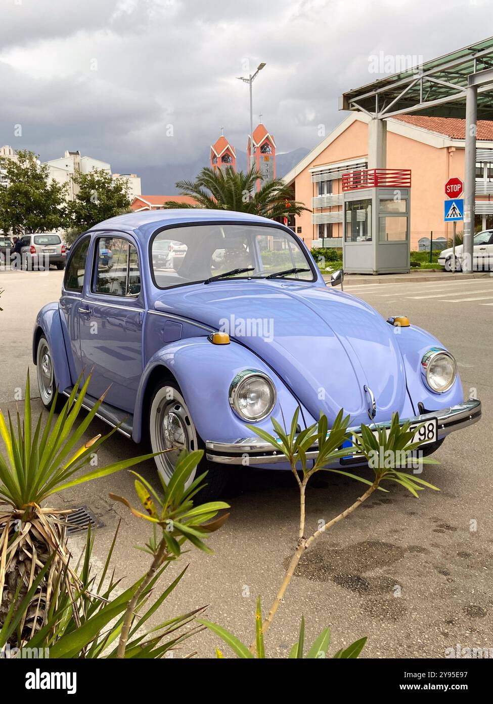 Vintage violet car on the street in summer. Old-fashioned nostalgia and ...