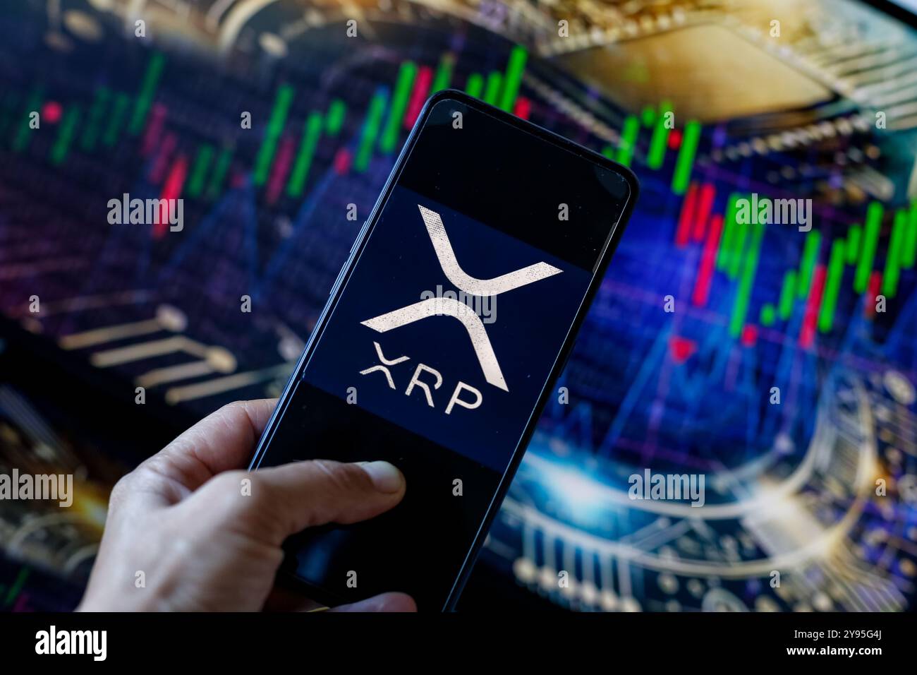 In this photo illustration, the XRP logo seen displayed on a smartphone ...