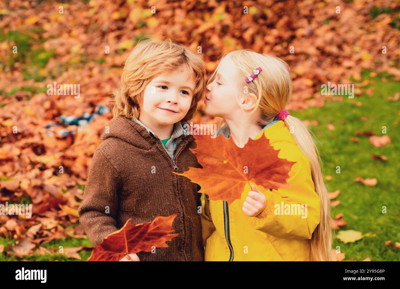 Romantic children at a park. Autumn style Stock Photo - Alamy