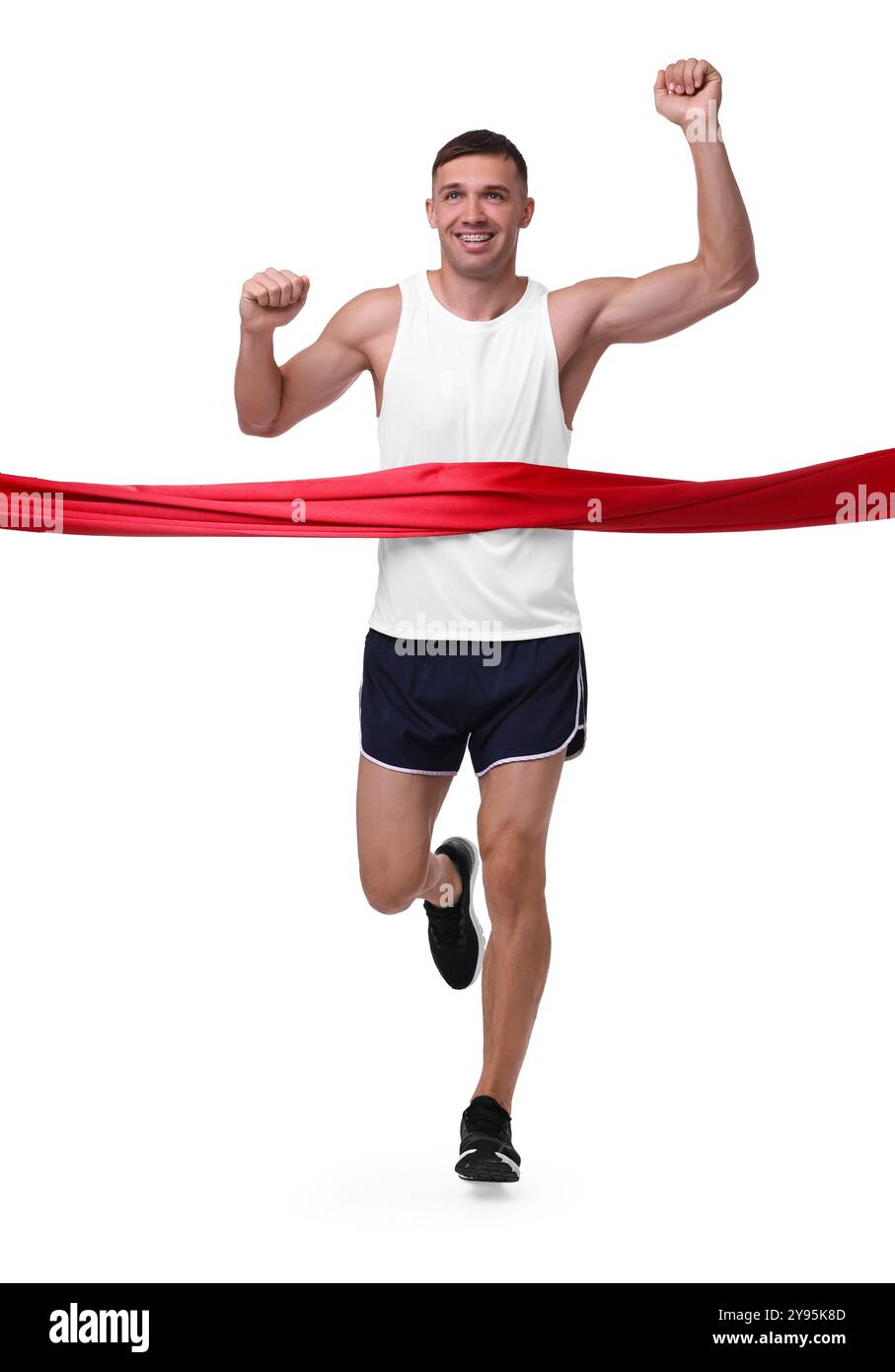 Man in sportswear crossing red finish line on white background Stock ...