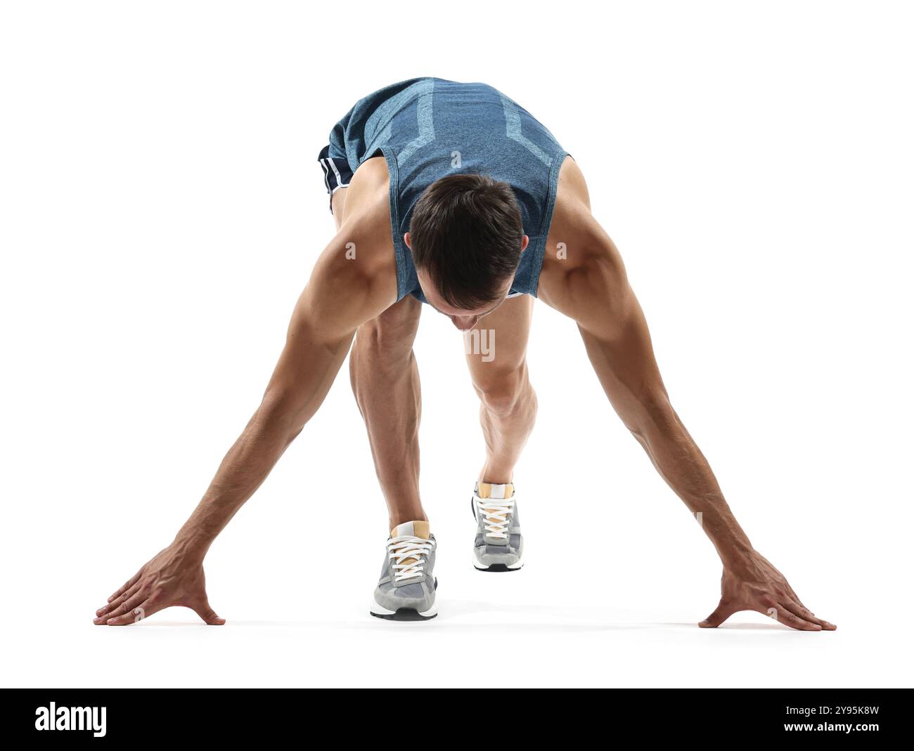 Sportsman in starting position for run on white background Stock Photo ...