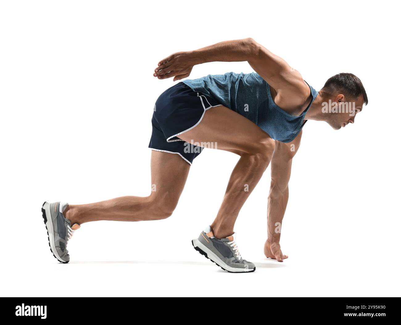 Sportsman in starting position for run on white background Stock Photo ...