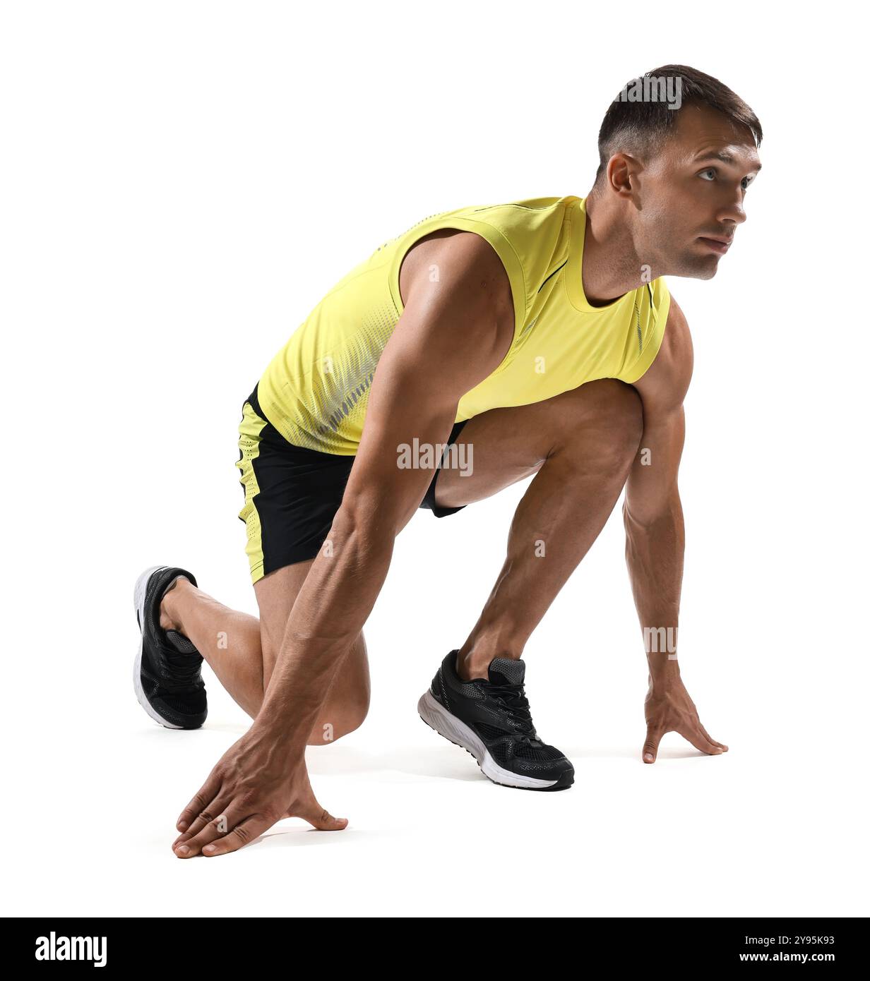 Sportsman in starting position for run on white background Stock Photo ...