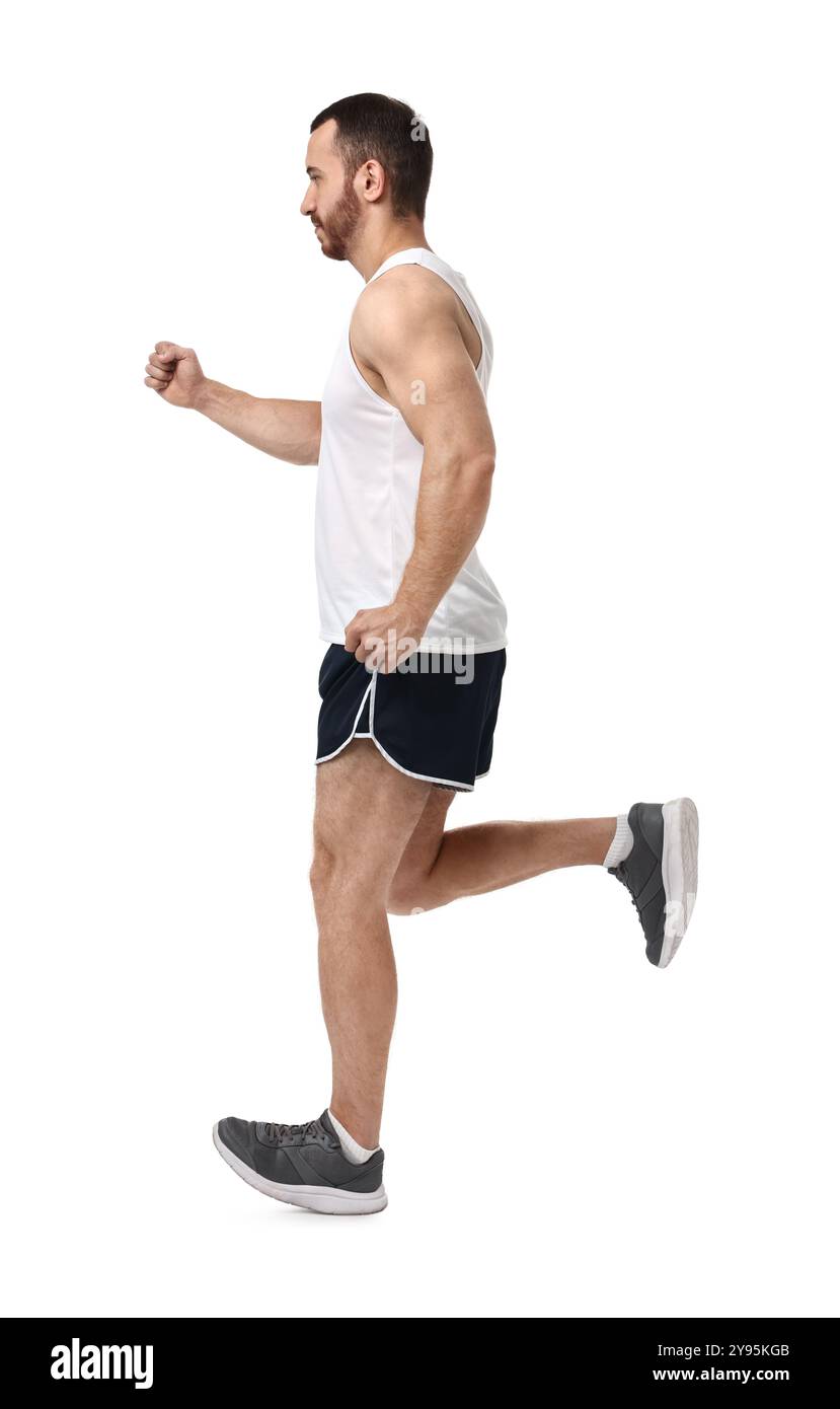 Handsome young man running on white background Stock Photo - Alamy