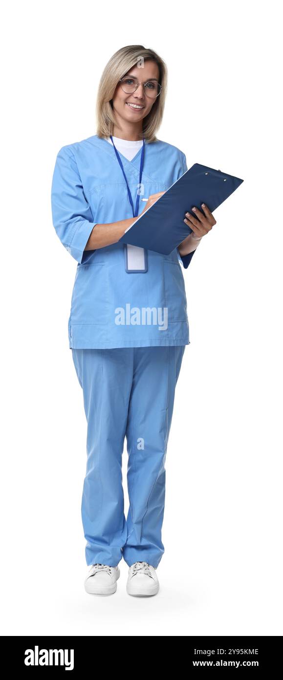 Smiling healthcare worker with clipboard and pen on white background ...