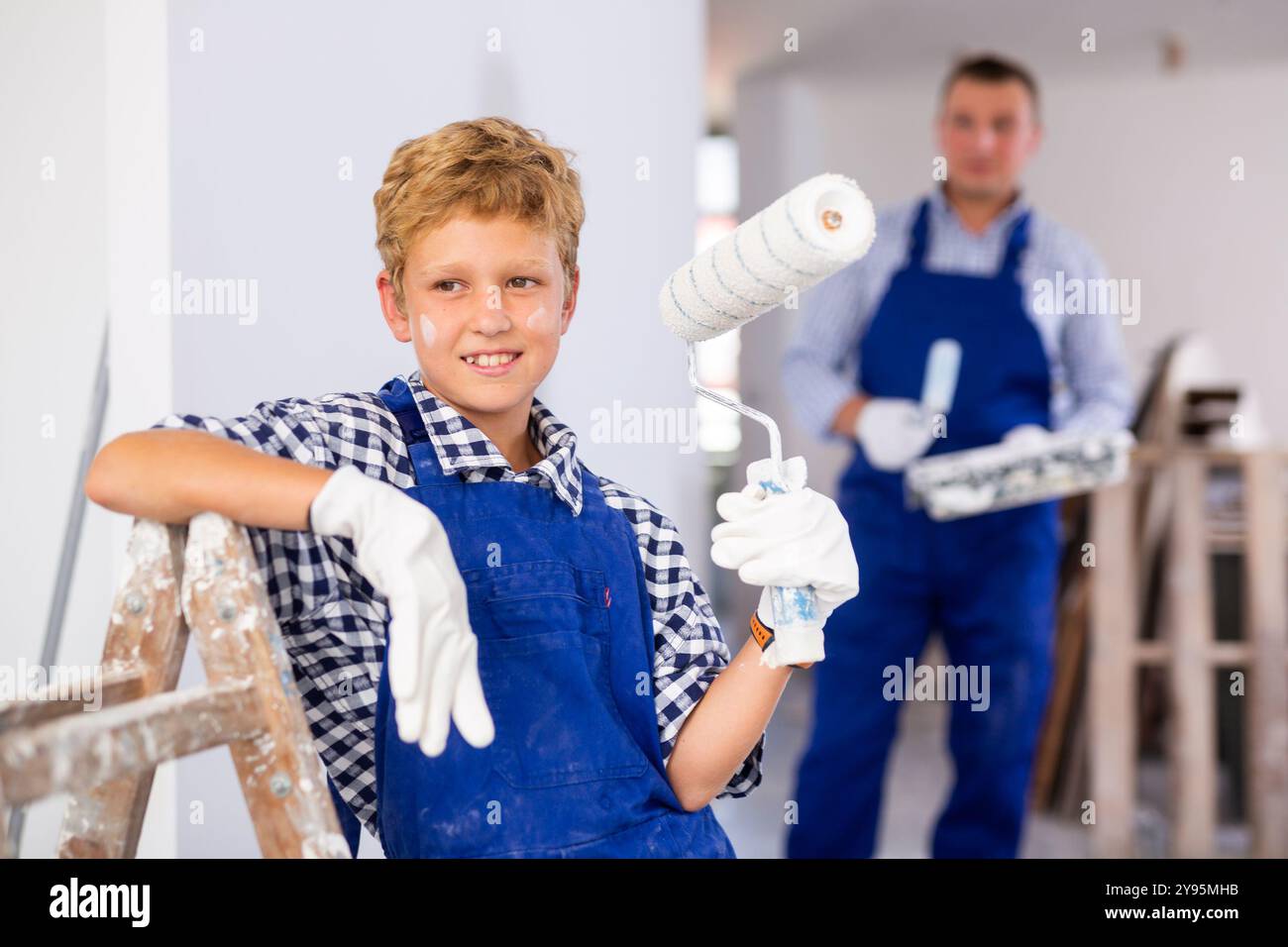 Boy posing with tools for home renovation Stock Photo - Alamy