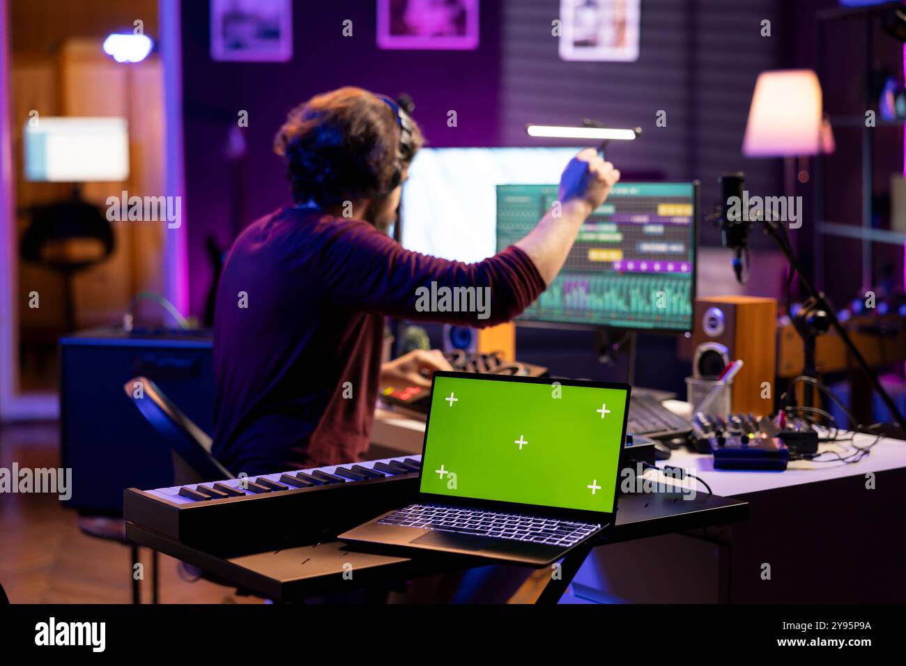 Sound engineer enhancing volume levels on daw software, editing ...