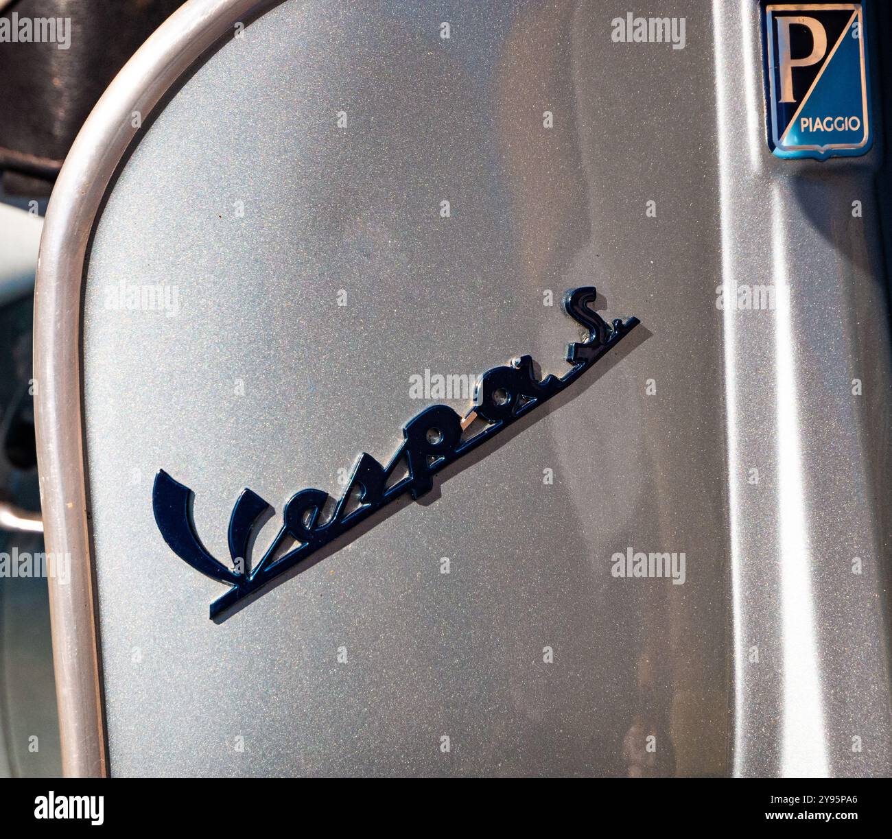 close-up shot of their Piaggio Vespa scooter, famous Italian vintage ...