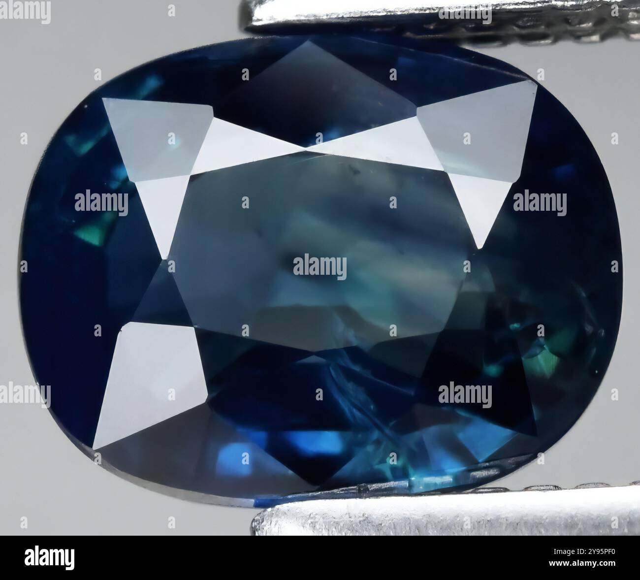 Radiant Deep Blue Sapphire Gemstone with Intricate Faceting Stock Photo ...