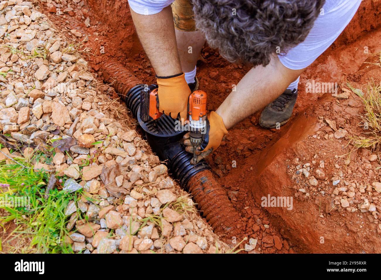 Damaged drainage system for collecting rainwater is replacement of ...