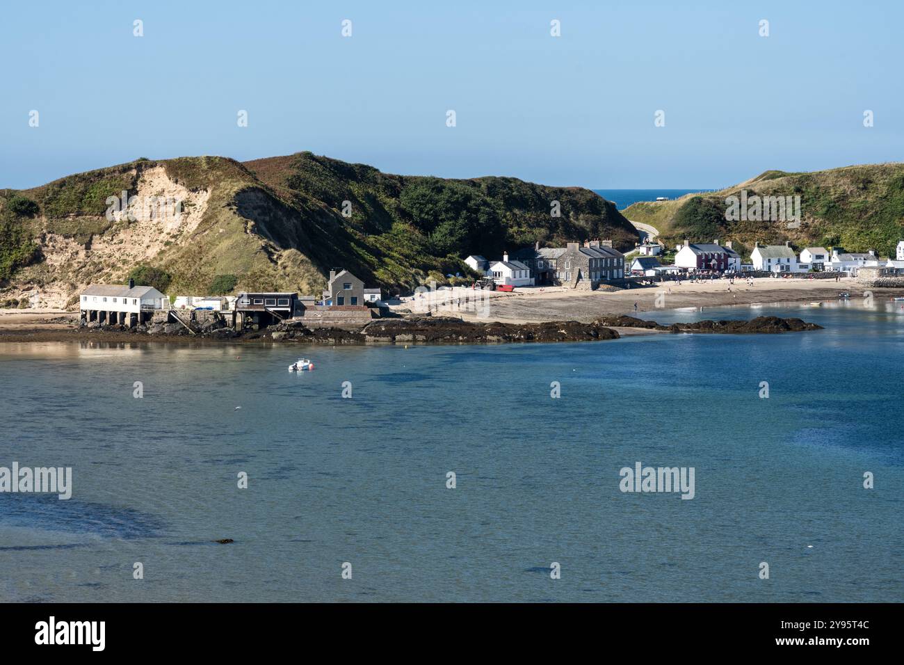 People relax on the beach at Porthdinllaen in Morfa Nefyn on the Llyn ...