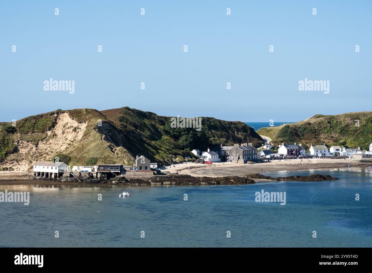 People relax on the beach at Porthdinllaen in Morfa Nefyn on the Llyn ...