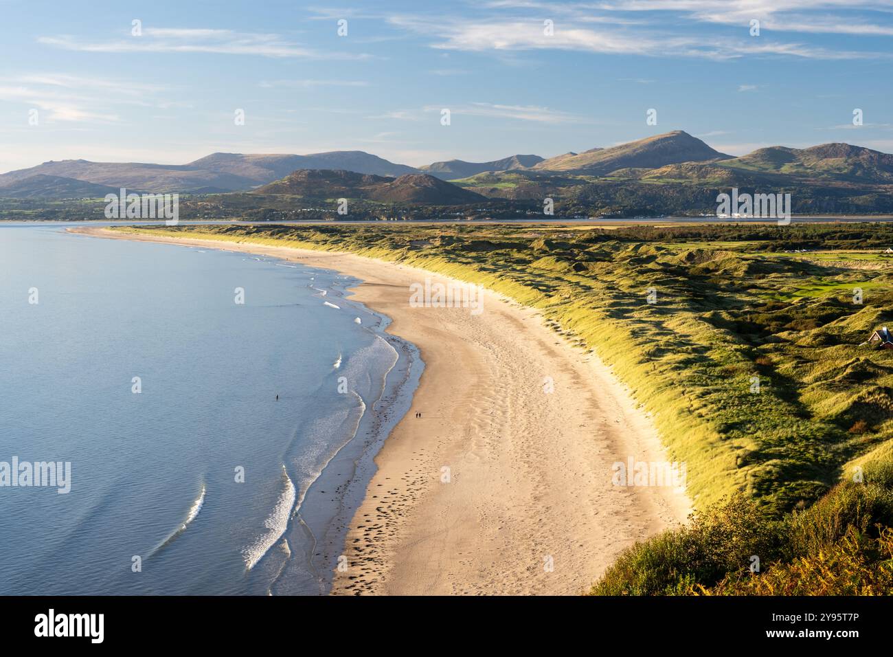 Sand dunes and a long beach line Tremadog Bay at Morfa Harlech in North ...