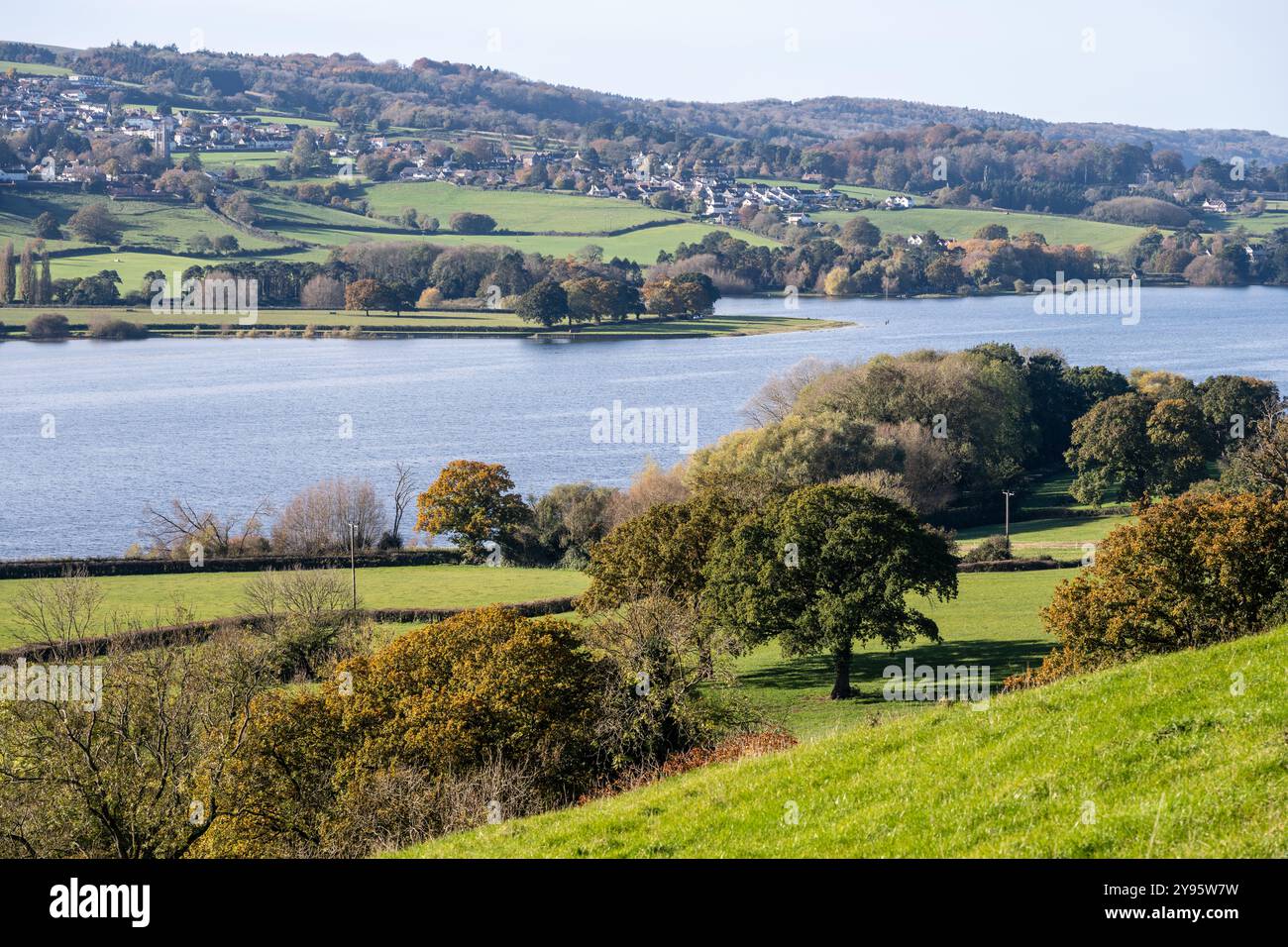 Sun shines on Blagdon village on the slopes of the Mendip Hills above ...