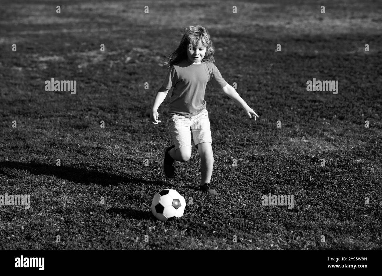 Soccer kid boy playing football. Child boy play football on outdoor ...