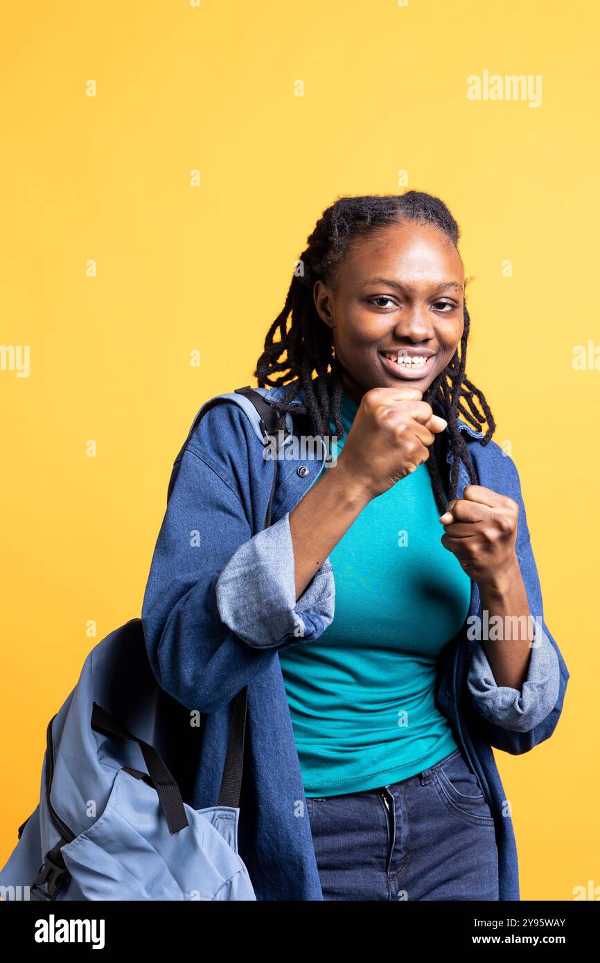 African american woman pretending to fight, throwing punches, holding ...