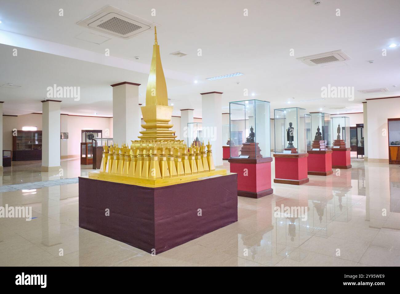 A gallery with various objects on display related to ancient traditions ...