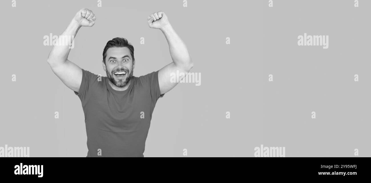 The winner. Successful man raising arms. Excited man with arms up ...