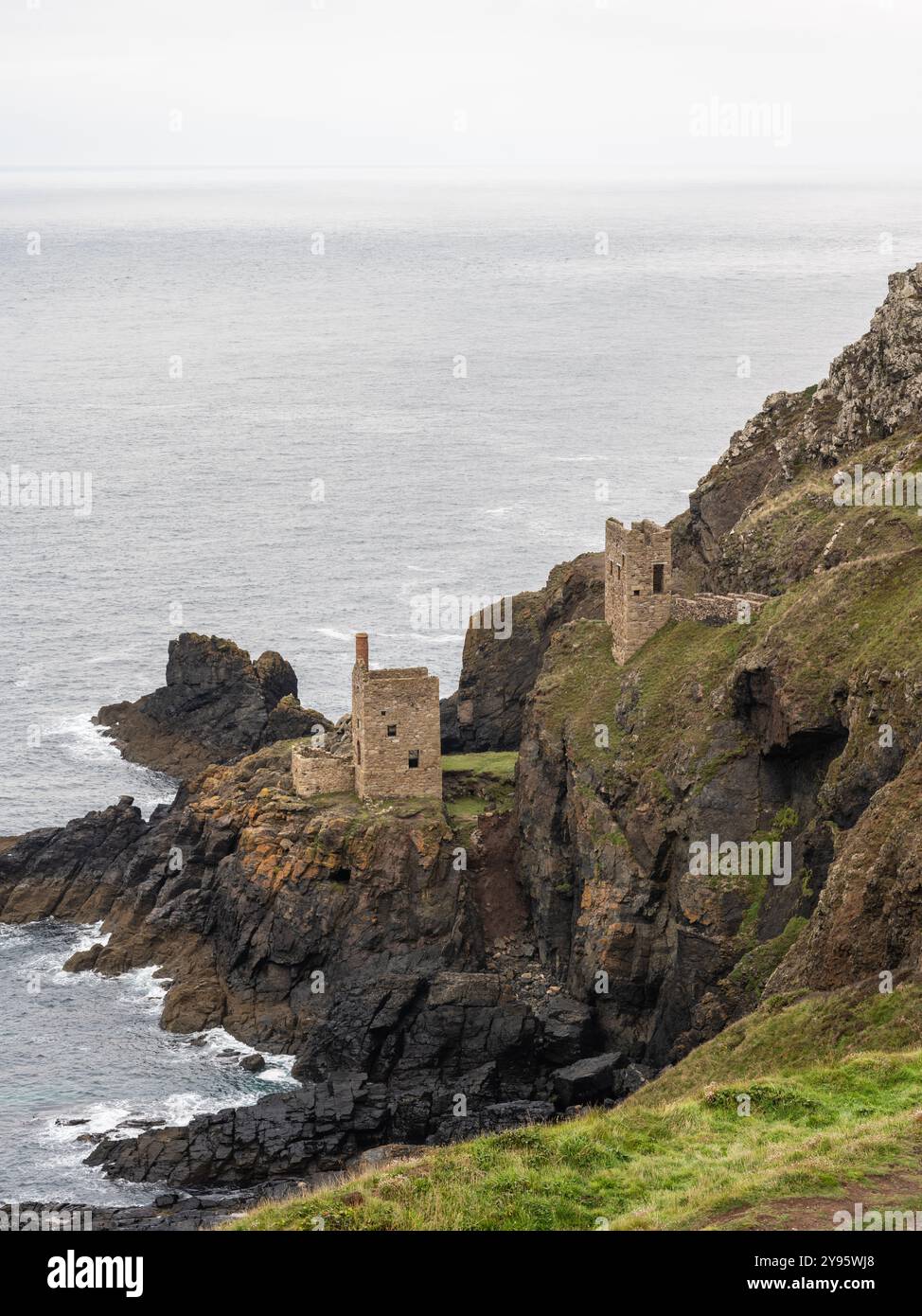 Engine houses dot the cliffs at Botallack tin and copper mines in ...
