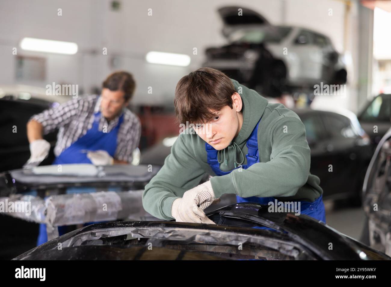 Male working car engine transportation automotive repairs hi-res stock ...