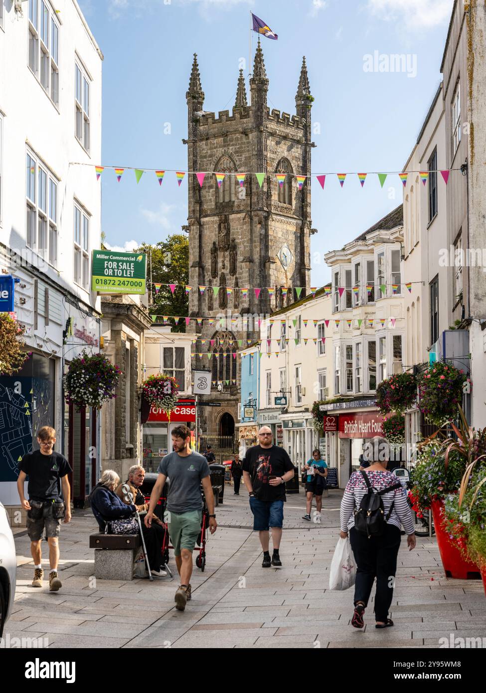 People walk along Fore Street, the main shopping street in St Austell ...