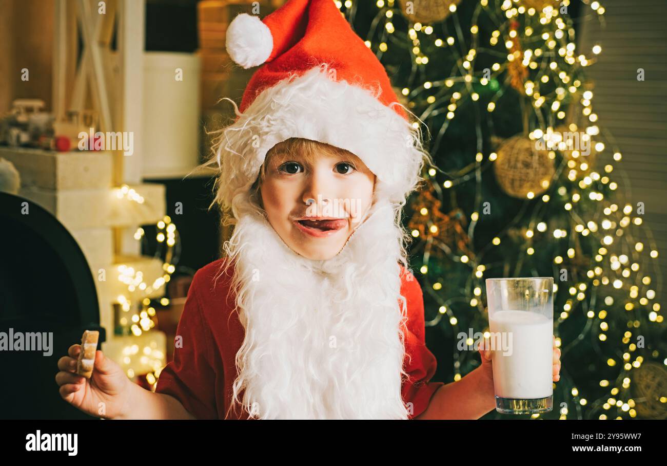 Santa child eating cookies and drinking milk. Christmas food and drink ...