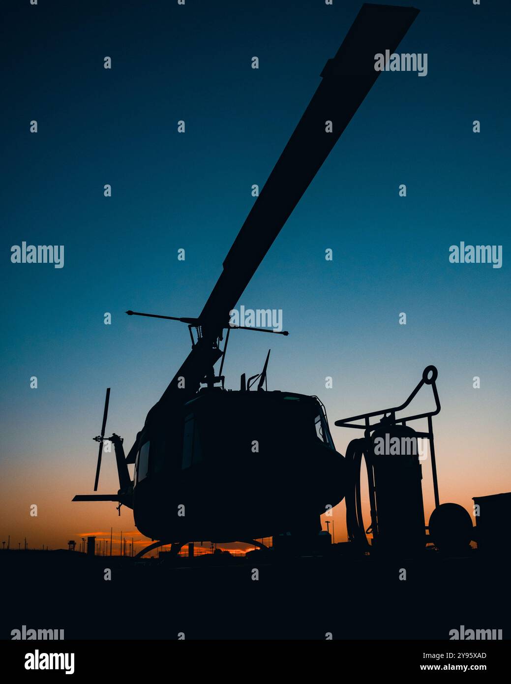 A UH-1N Huey attached to the 37th Helicopter Squadron sits on a helipad ...