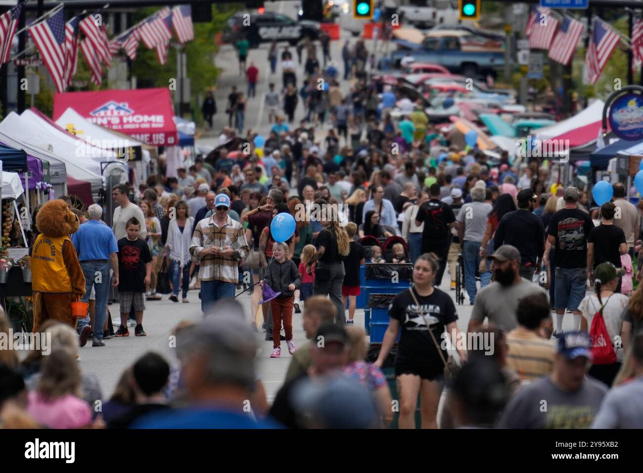 FILE - People attend the Butler Fall Festival in Butler, Saturday, Sept ...