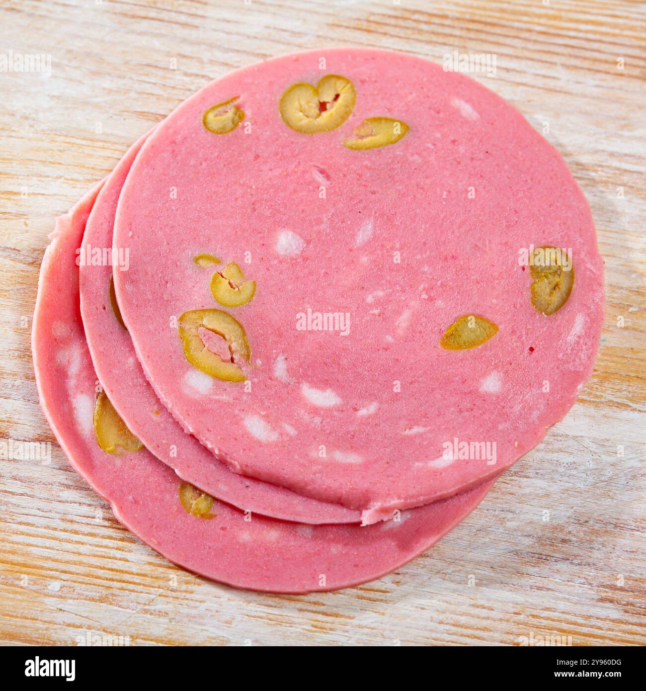 Slices of Mortadella with olives Stock Photo - Alamy