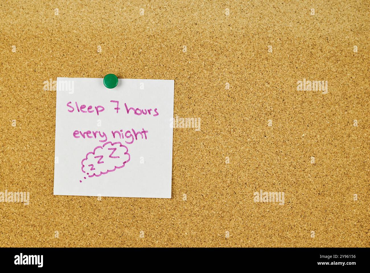 Post It notes with resolutions and goals achieved, placed on the cork ...