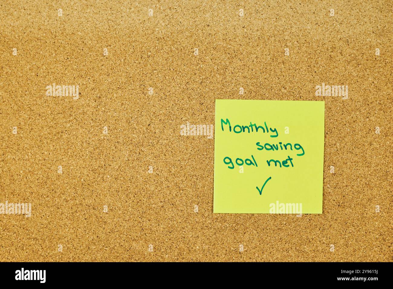 Post It notes with resolutions and goals achieved, placed on the cork ...