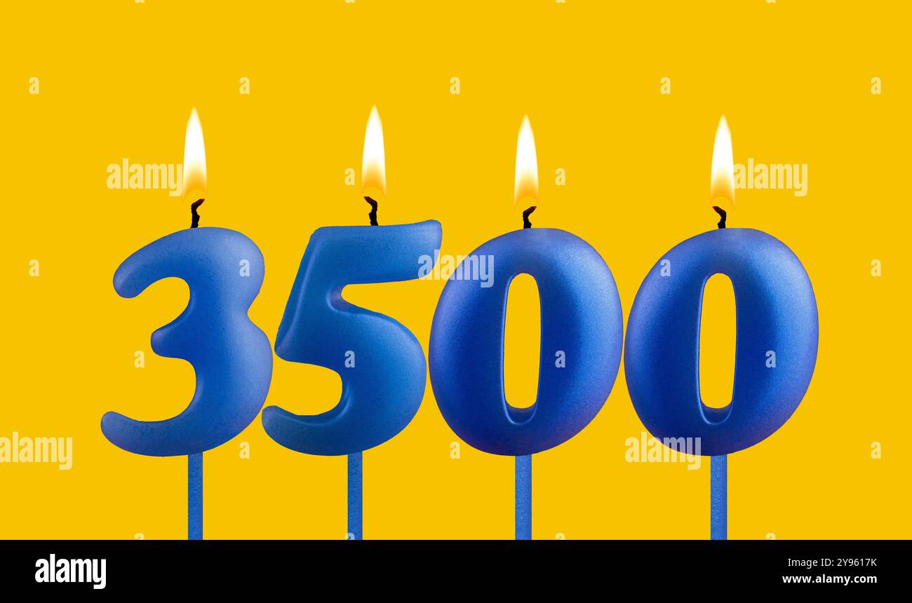 Blue birthday candle on yellow background - Number 3500 Stock Photo - Alamy