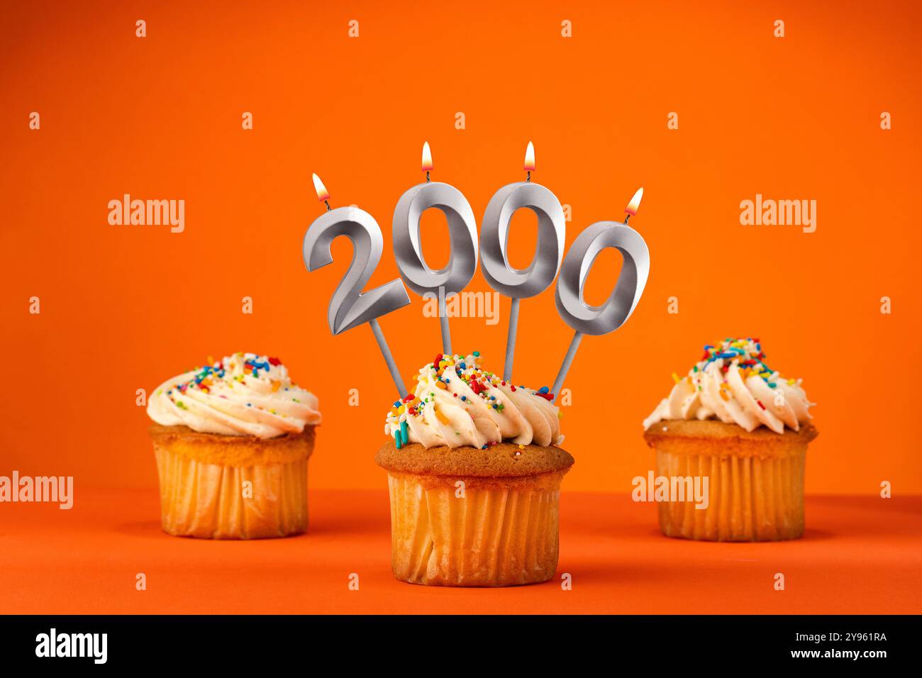 Candle number 2000 - Celebration with birthday cupcake on orange ...