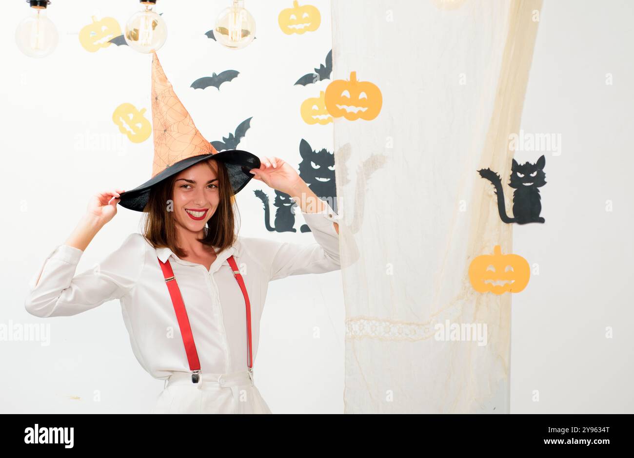 Surprised woman in witches hat and short dress. Vampire Halloween Woman ...