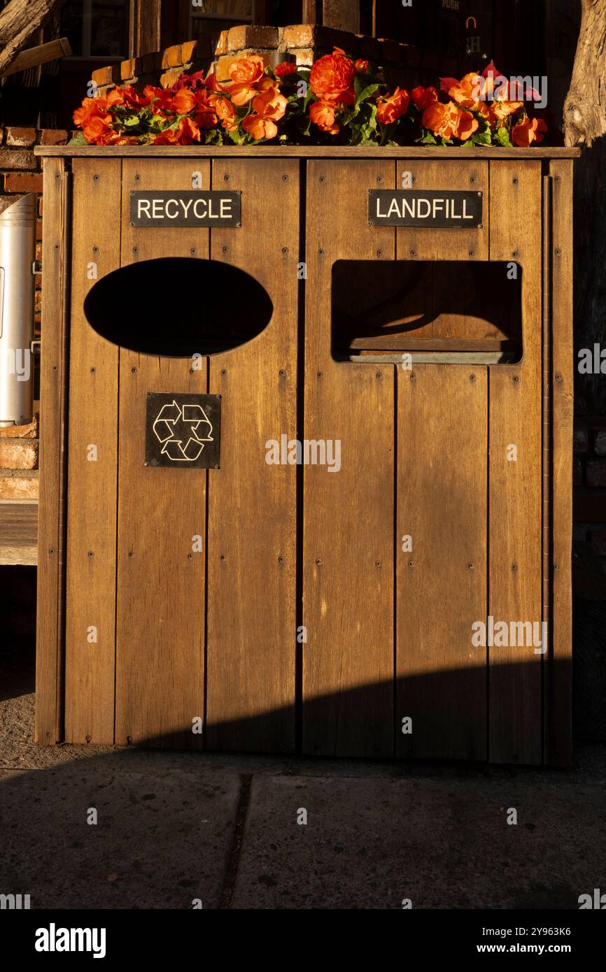 Two public containers for recycle and for landfill on the sidewalk on ...