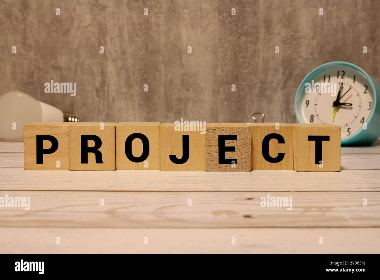 Project word from wooden blocks on gray background Stock Photo - Alamy