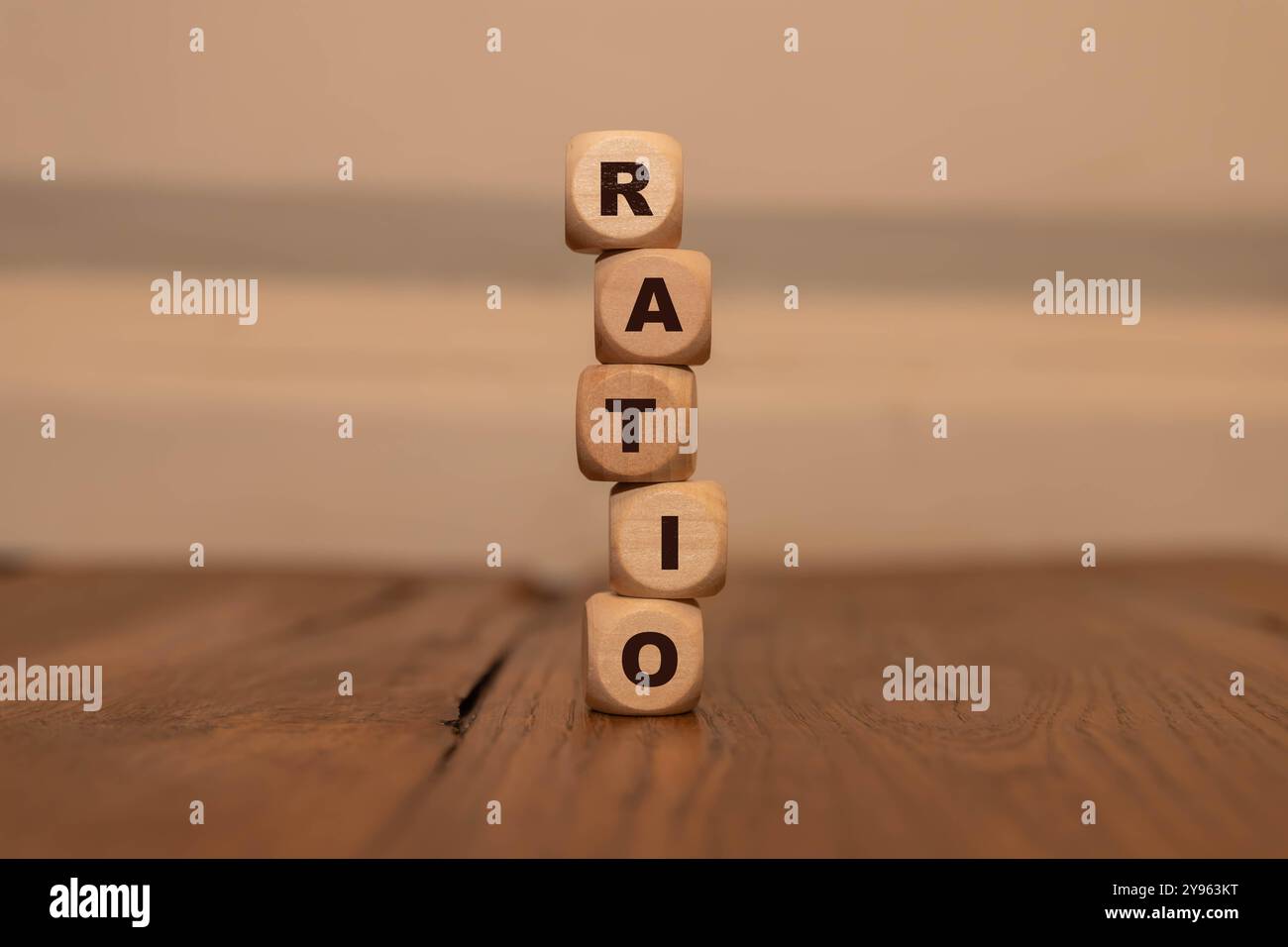 RATIO text on a wooden block on graph background with pen and magnifier ...