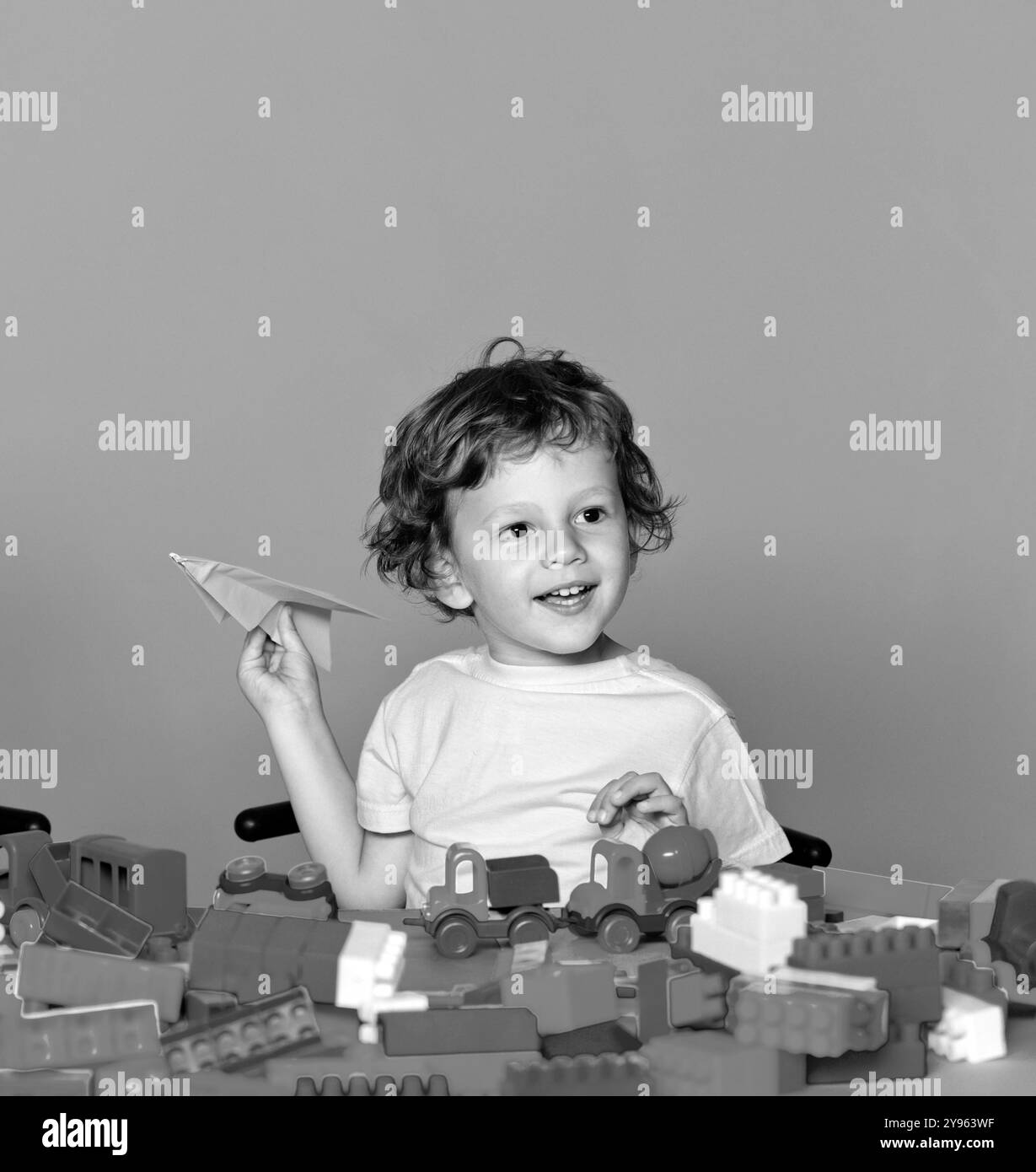 Cheerful smiling little pupil having fun. Little ready to study. Kid ...